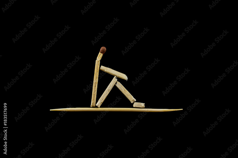 The sitting man. The figure of a man stilized by the matches on the ...