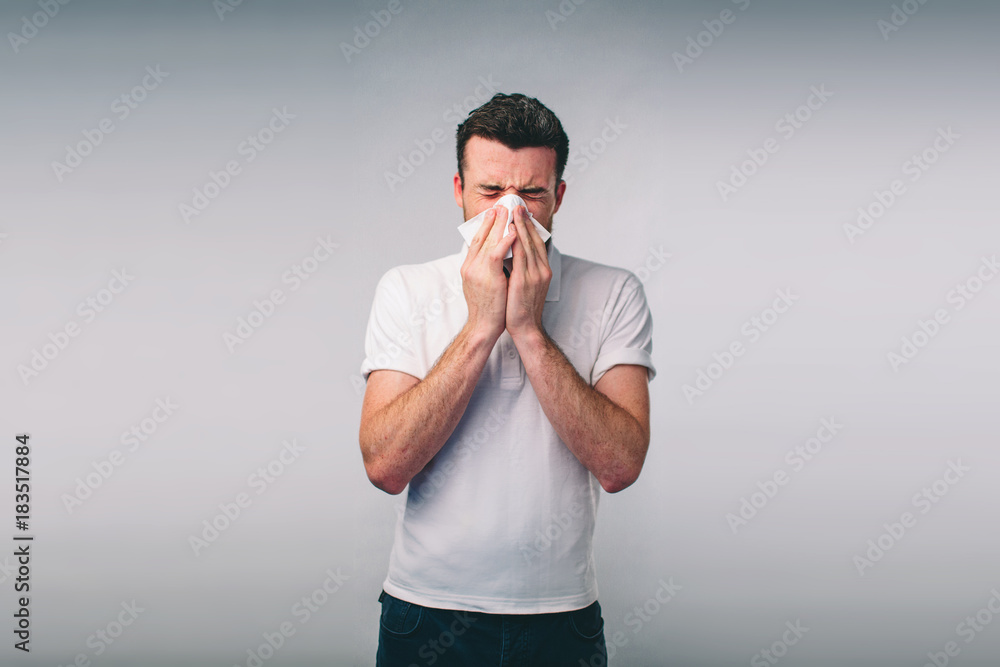 studio picture from a young man with handkerchief. Sick guy isolated ...