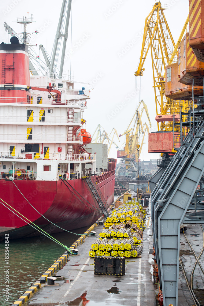 Vessel dry cargo on loading, unloading in port. Bulker in port. port ...