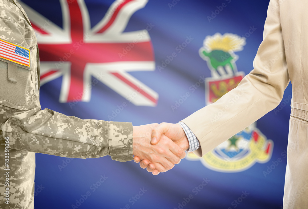 USA military man in uniform and civil man in suit shaking hands with ...