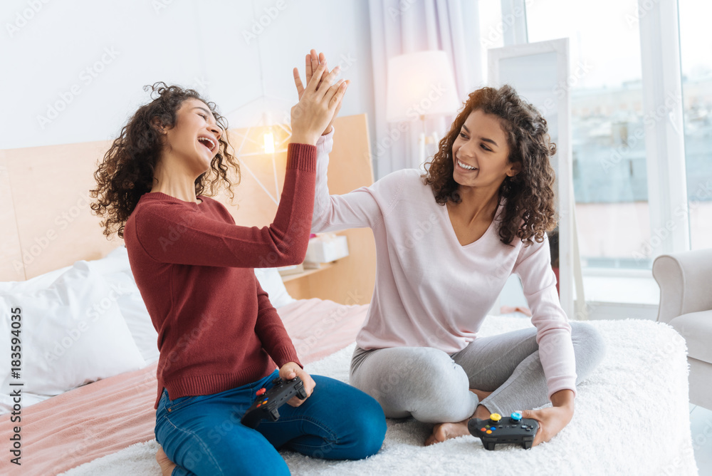 Best team ever. Extremely happy siblings giving each other a high five ...