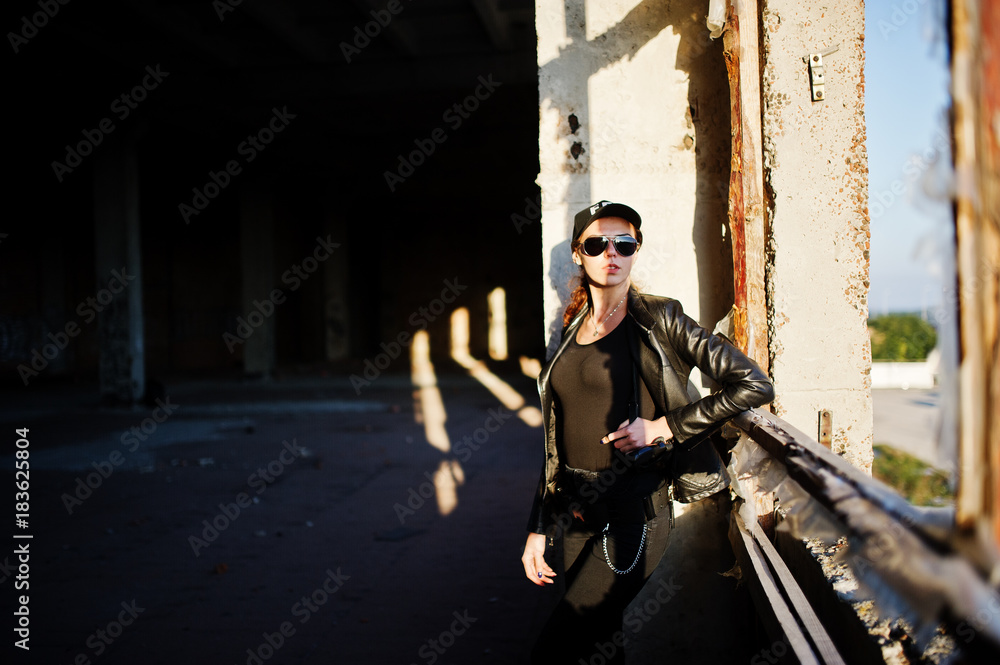 Sexy FBI female agent at abadoned place. Stock Photo | Adobe Stock