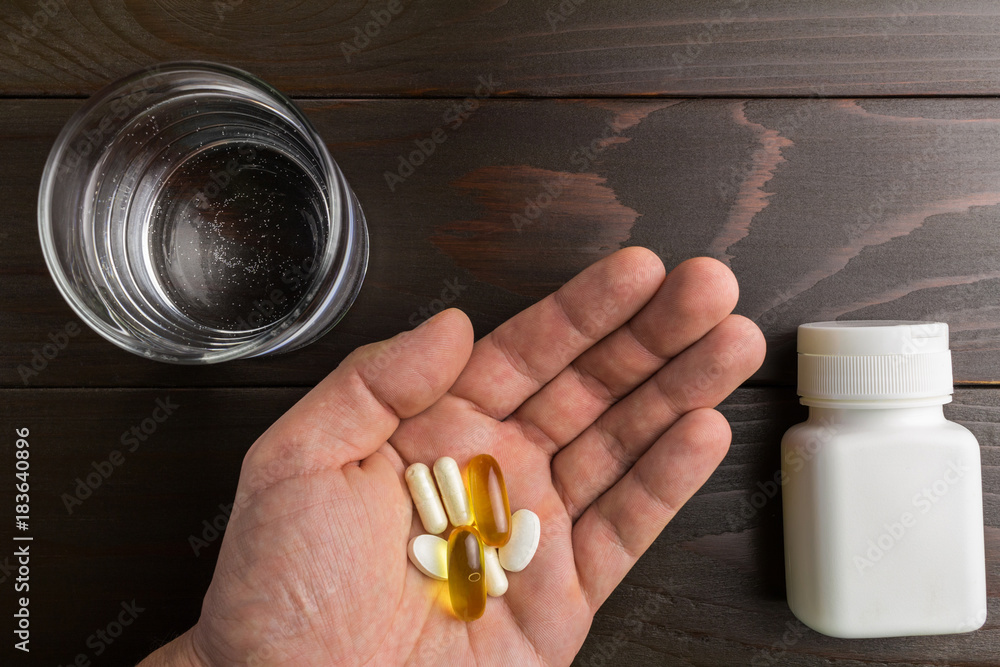 Hand hold vitamin complex and dietary supplement, capsules of omega 3 ...