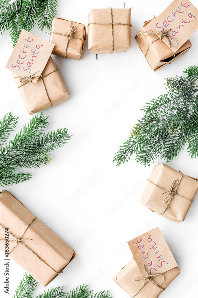 Secret Santa christmas game. Wrapped gift boxes with handwritten notes ...