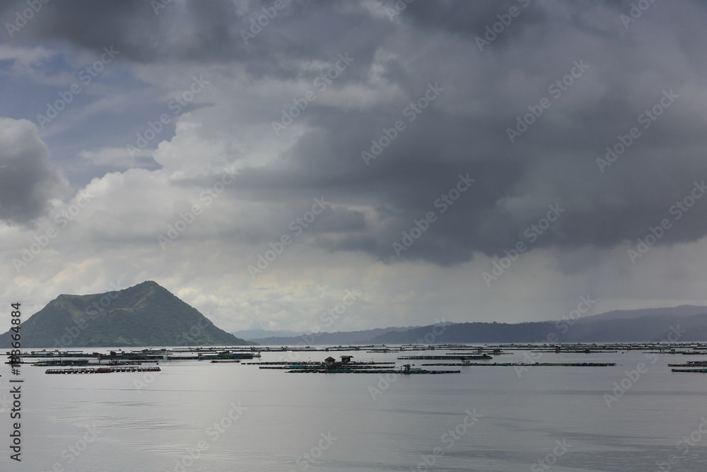 Fish cages-tilapia farming. Binintiang Malaki-Big Leg crater background ...