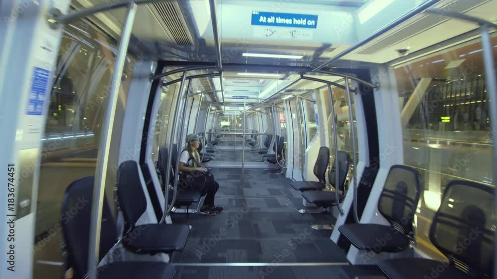 Monorail with train at Doha International Airport, Qatar. Train on the ...