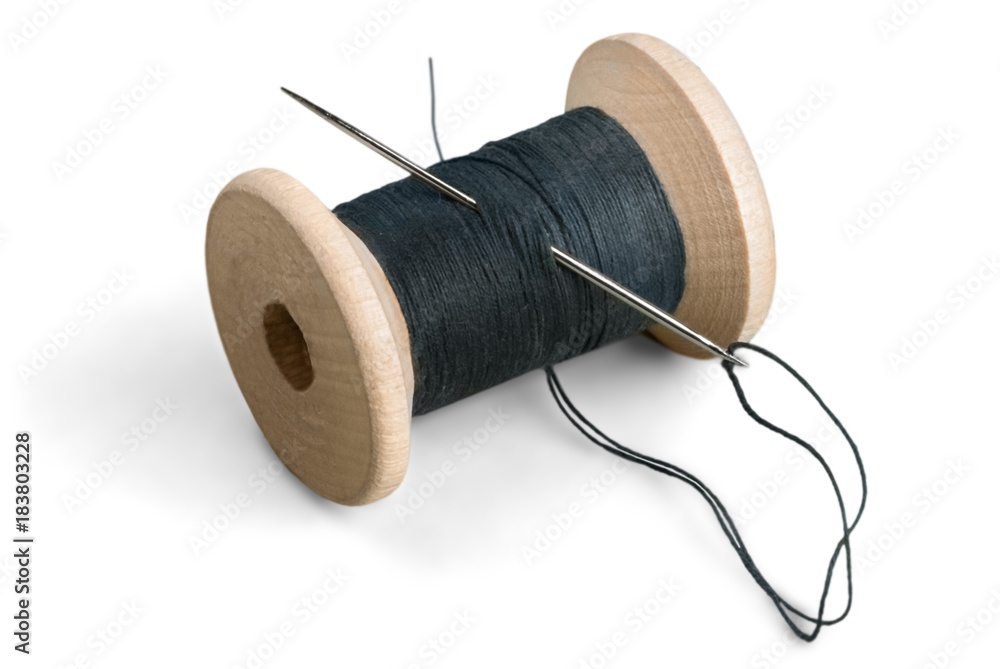 Spool of Thread and Needle Stock Photo | Adobe Stock