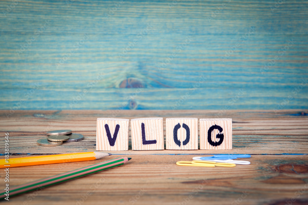 vlog - name from wooden letters. Office desk, informative and ...