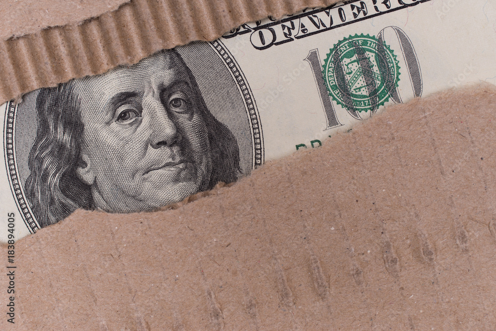 Benjamin Franklin macro through torn paper carton Stock Photo | Adobe Stock