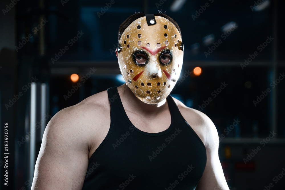 horror brutal mask man strong bodybuilder athletic fitness man in scary ...