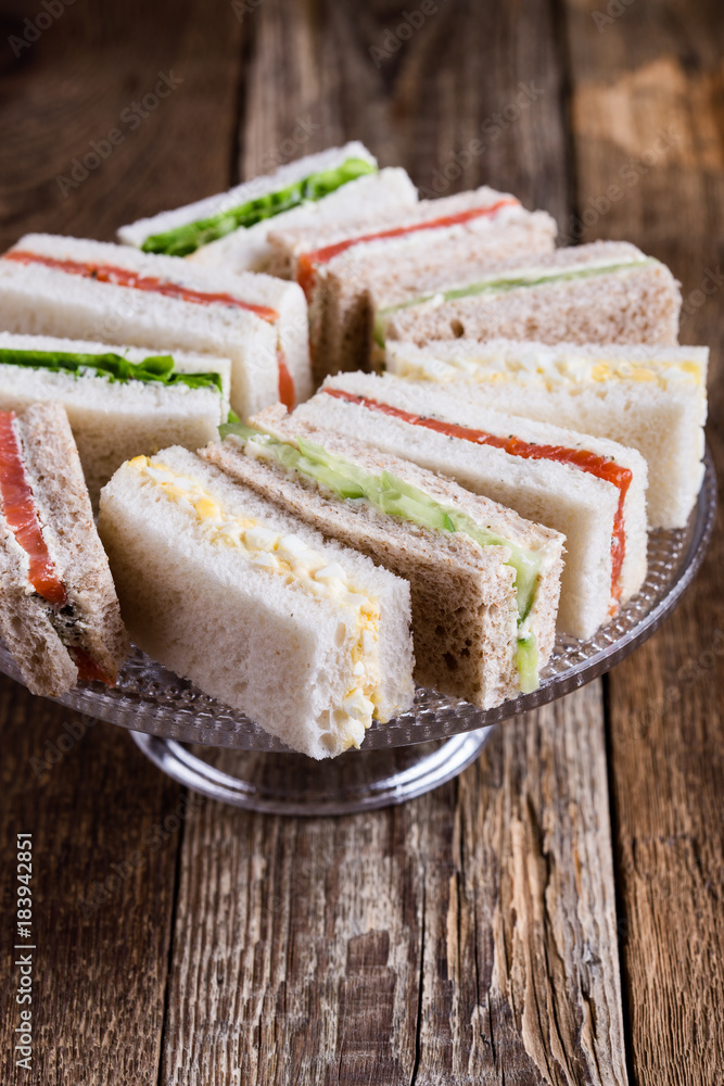 English tea sandwiches on cake stand Stock Photo | Adobe Stock