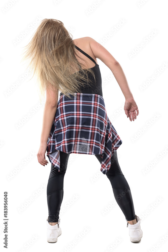 Back view of moving graceful relaxed woman enjoying music with flowing ...