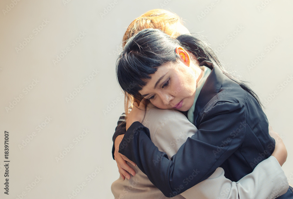 Side view of two sad friends embracing each other. Stock Photo | Adobe ...