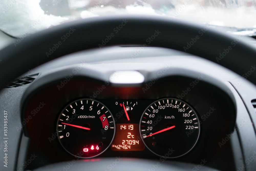 The speedometer in the car. From behind the steering wheel you can see ...