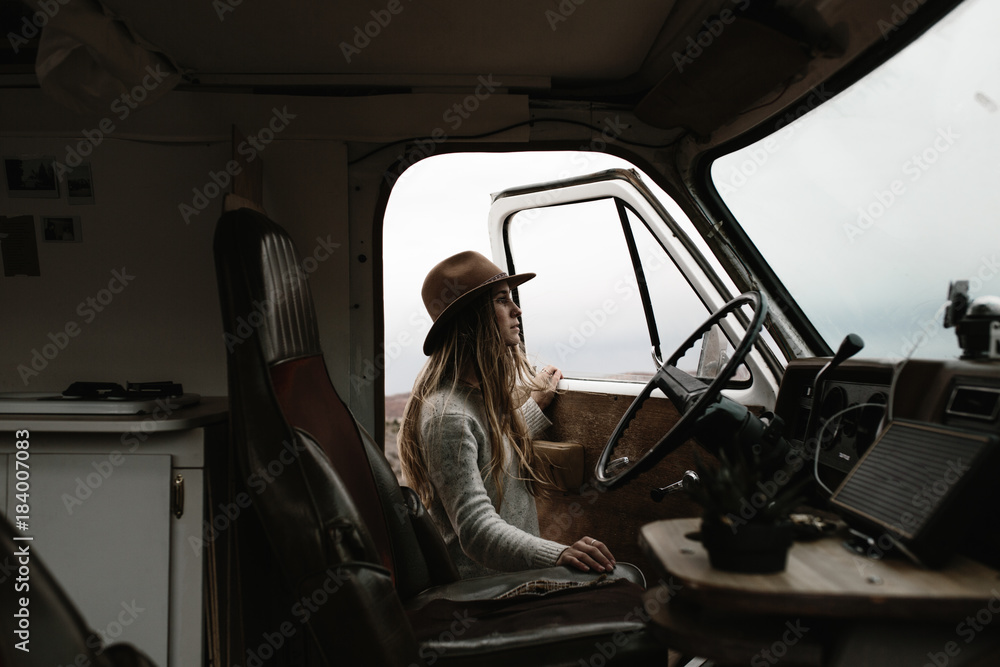 woman getting into van from driver's door Stock Photo | Adobe Stock