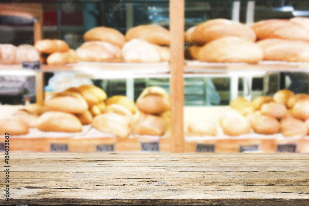 Wood table top on bakery shop background. Stock Photo | Adobe Stock