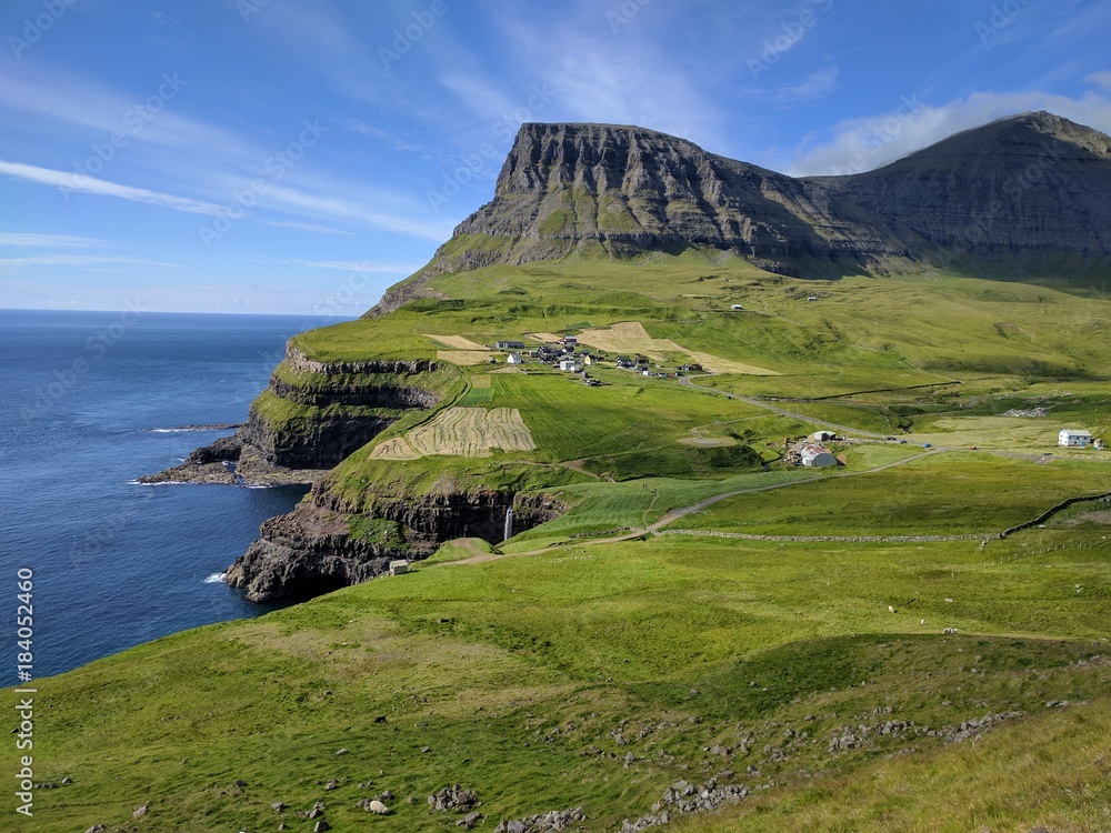 Gasadalur village and its iconic waterfall, Vagar, Faroe Islands ...