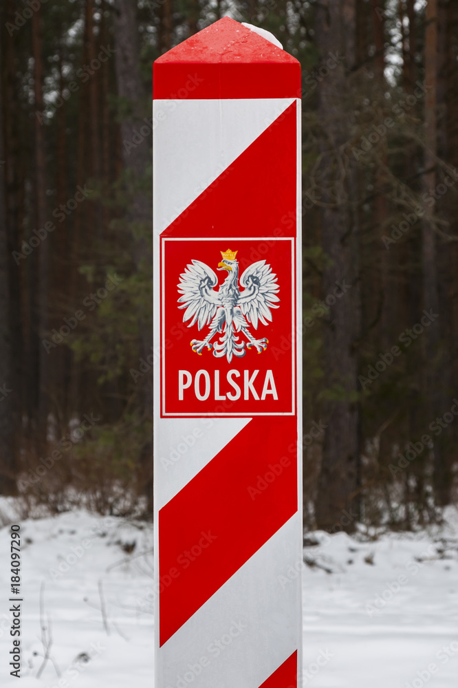 Border post with the emblem of the Polish. Border of Poland in winter ...