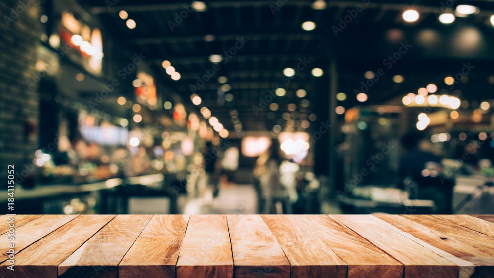 Wood table top (Bar) with blur light bokeh in dark night cafe ...