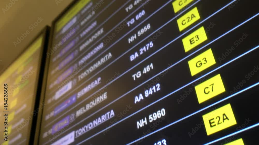Departures monitor display board showing destinations flights for ...