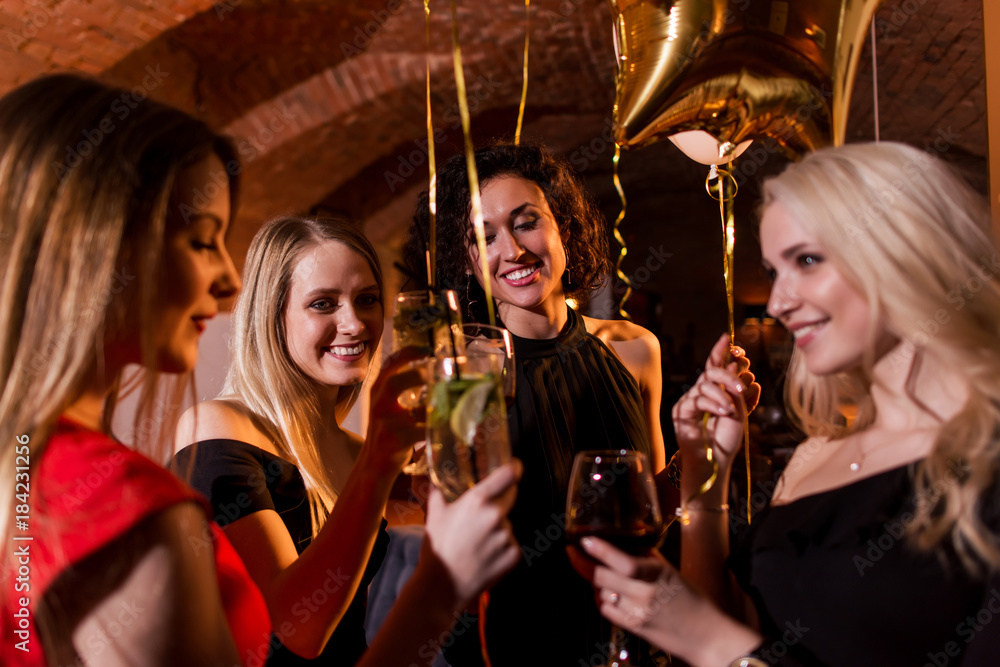 Happy attractive young women having birthday party laughing, dancing ...