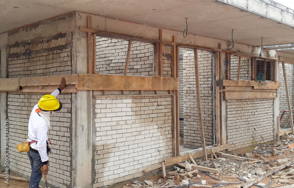 Bricklayer calcium silicate bricks block and stacked it together using ...