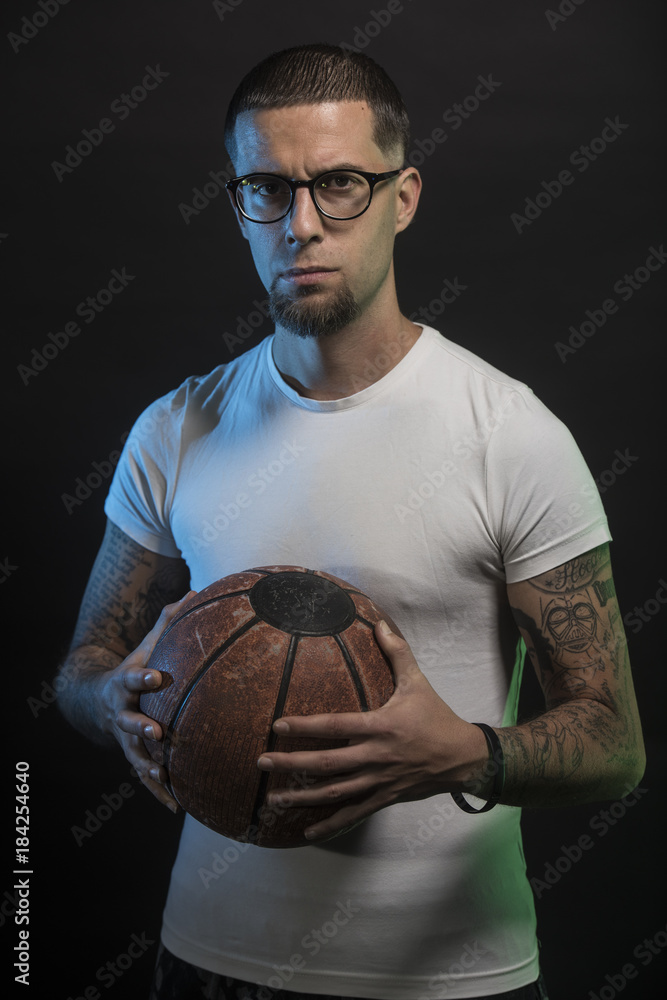 Studio portrait of sportsmen using balls Stock Photo | Adobe Stock