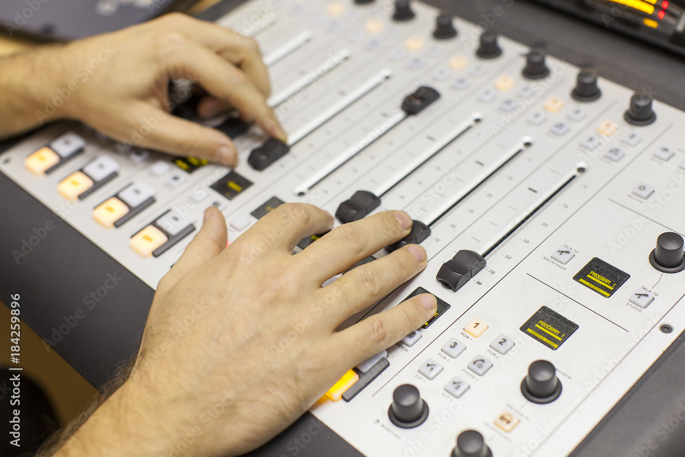hands on the arms of the equalizer closeup, radio DJ Stock Photo ...
