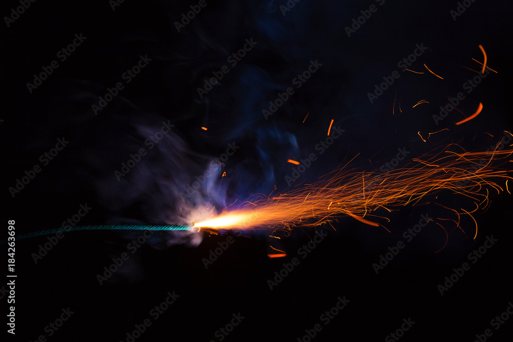 Burning fuse with sparks and blue smoke on black background Stock Photo ...