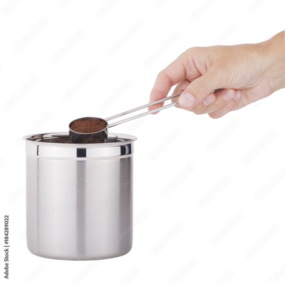 Loading spoon of coffee from stainless steel jar, stages of coffee ...