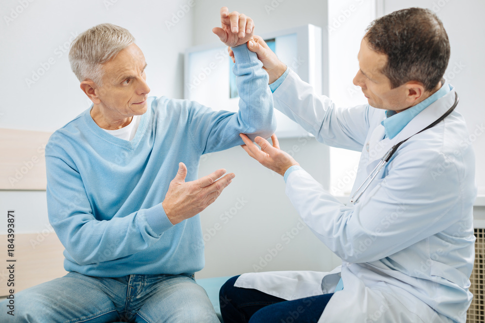 What is with me. Concerned anxious aged man holding his hand up and ...