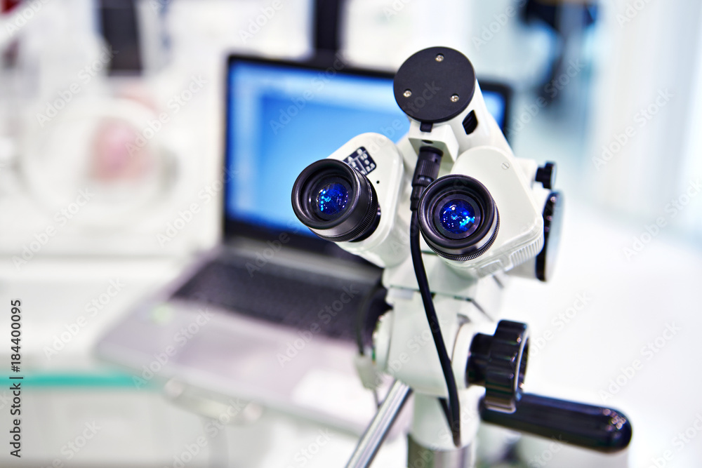 Microscope eyepieces and laptop Stock Photo | Adobe Stock