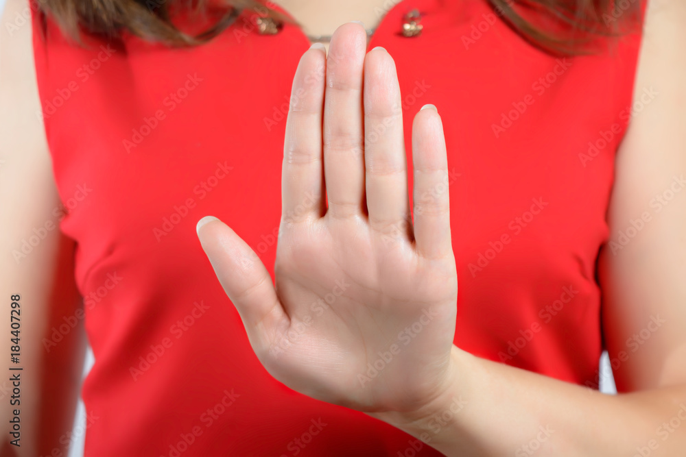 stop sign of female hand on the red background of dress Stock Photo ...
