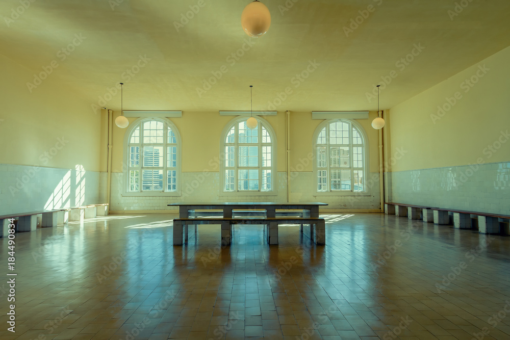 Waiting room of an old hospital with windows in the background and a ...