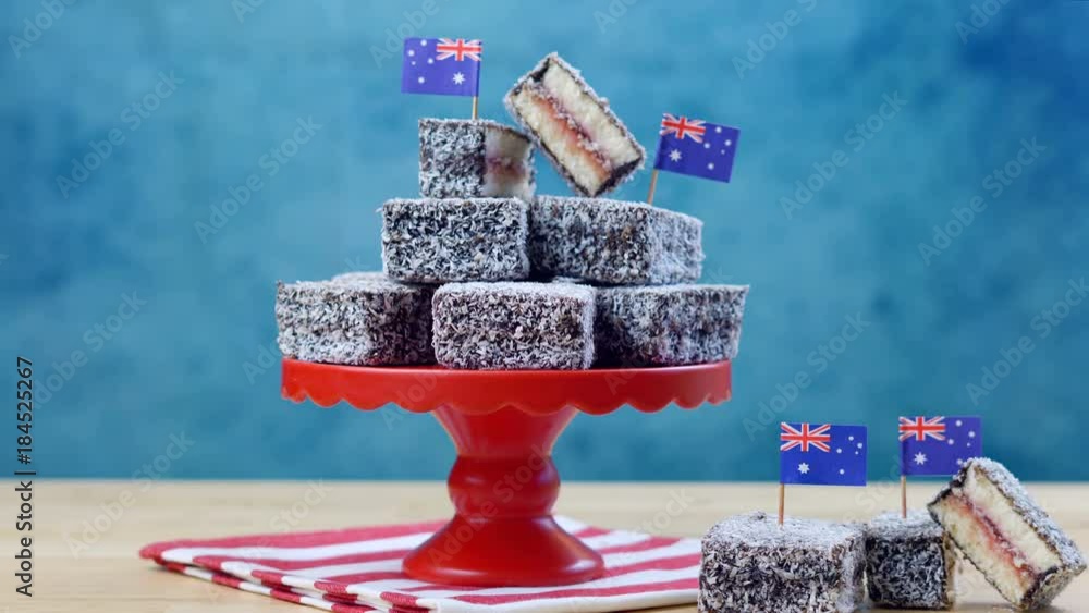 Iconic traditional Australian party food, Lamington cake, on a red ...