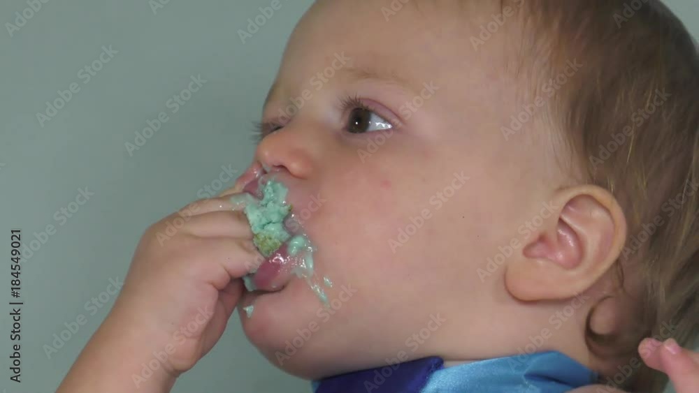 first birthday boy cake smash eating messy icing close up 4k Stock ...