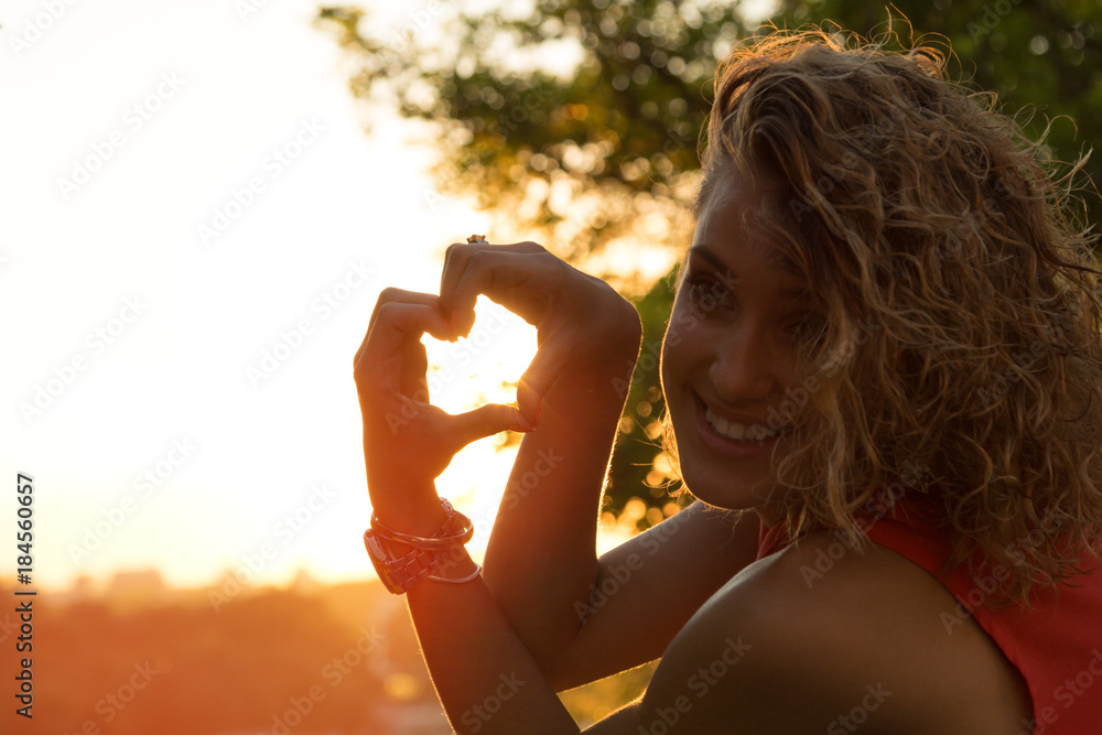 Beautiful woman making heart shape with hands. Summer concept. Stock ...