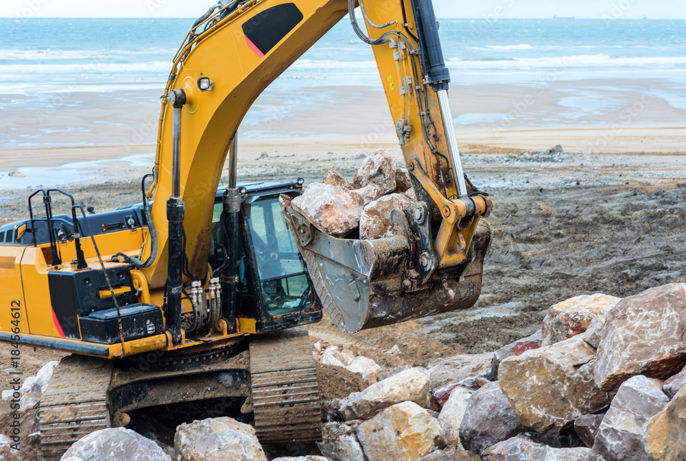 pelleteuse en action sur le chantier Stock Photo | Adobe Stock