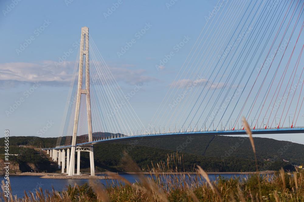 Amazing zooming out aerial view of the Russky Bridge, the world's ...