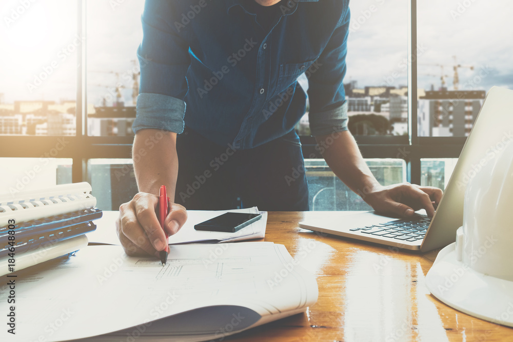 Image of engineer drawing a blue print design building or house, An ...