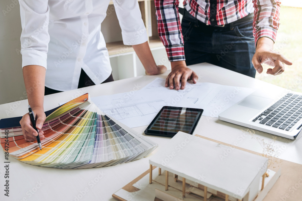 Two interior design or graphic designer at work on project of ...