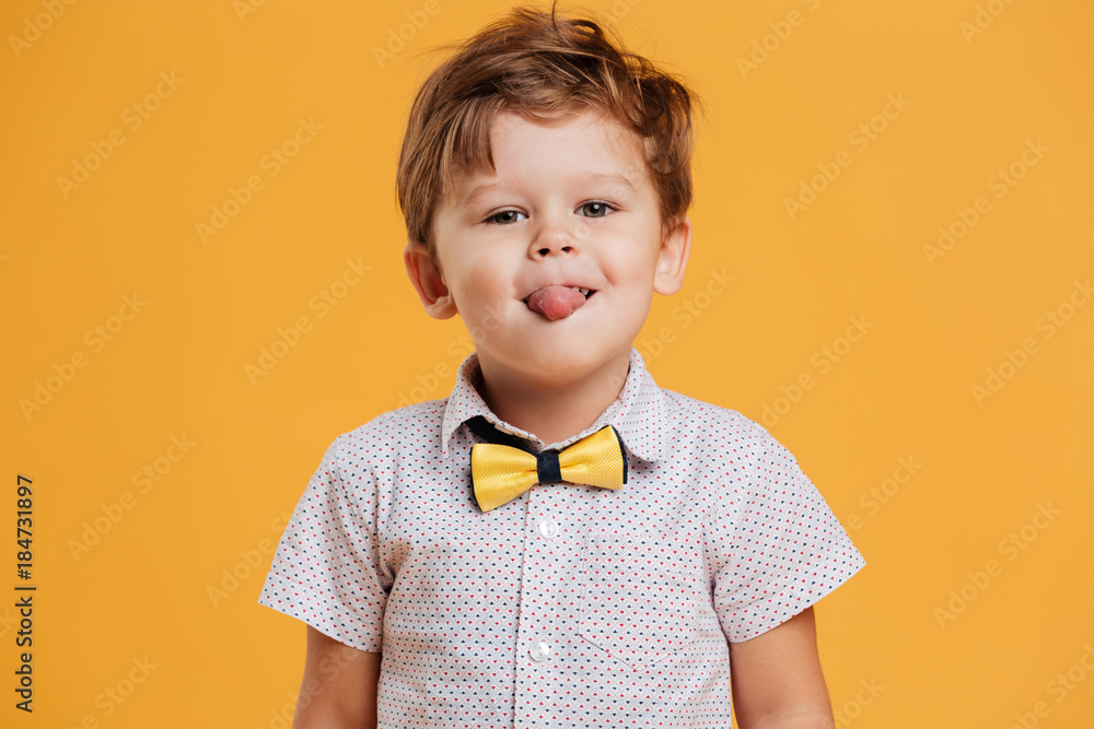 Funny little boy child standing isolated Stock Photo | Adobe Stock