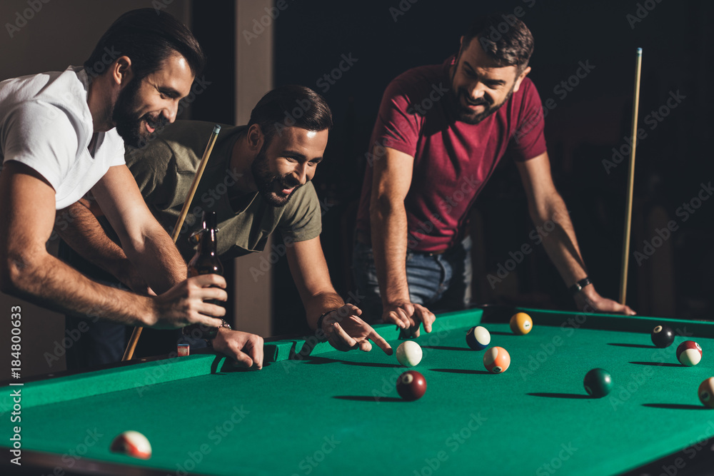 group of young handsome men playing in pool at bar Stock Photo | Adobe ...
