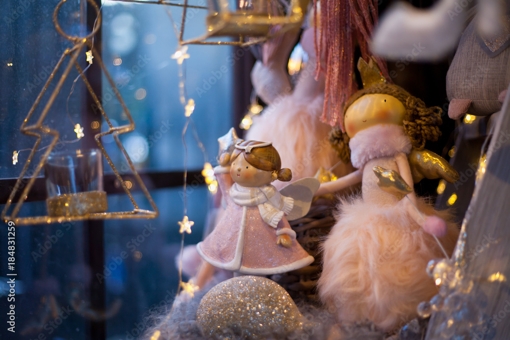 Angel figurine by window and gold tree, White Christmas decoration ...