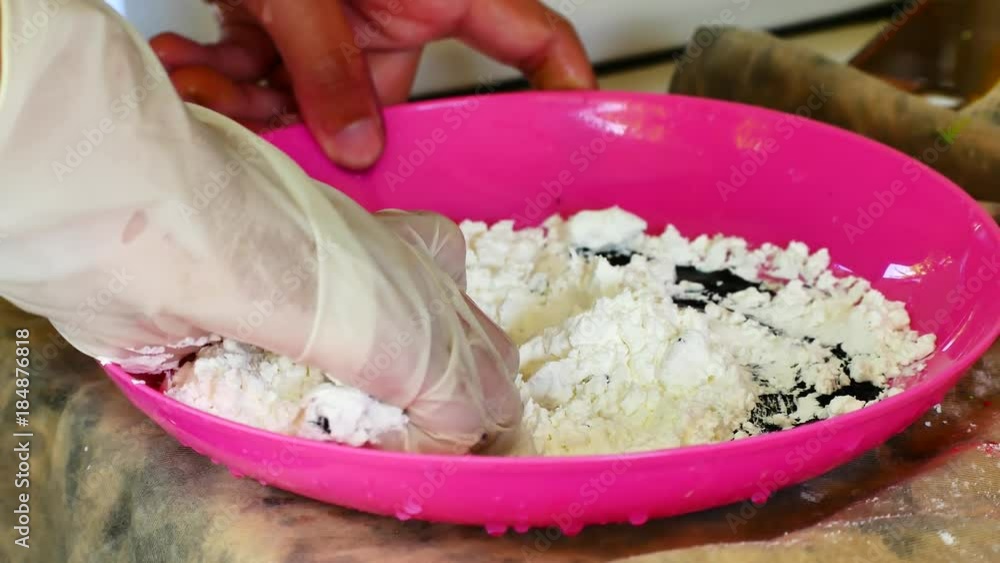 How to make colored powder, holi Festival. The hands are salting food ...