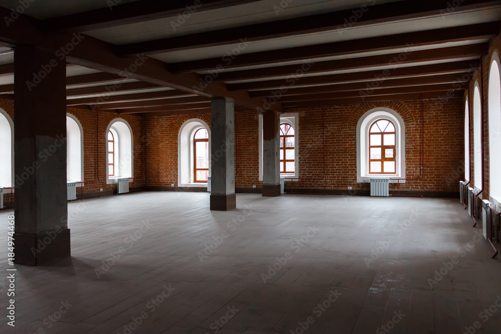 Loft studio Interior in old house. Big windows, brick red wall ...