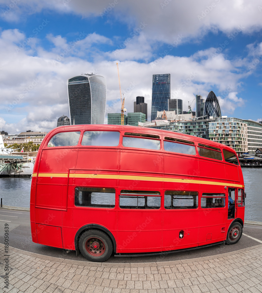 Red double decker bus with modern skyscrapers in London, England, UK ...