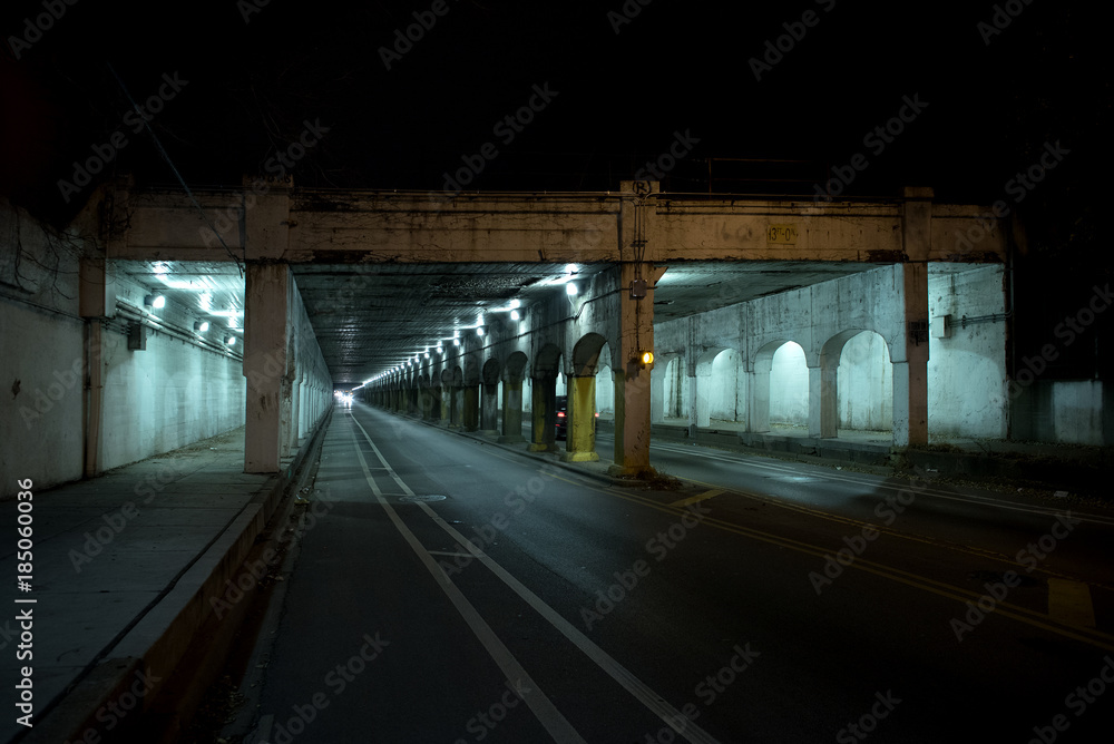 Dark Chicago city alley industrial train bridge underpass at night ...