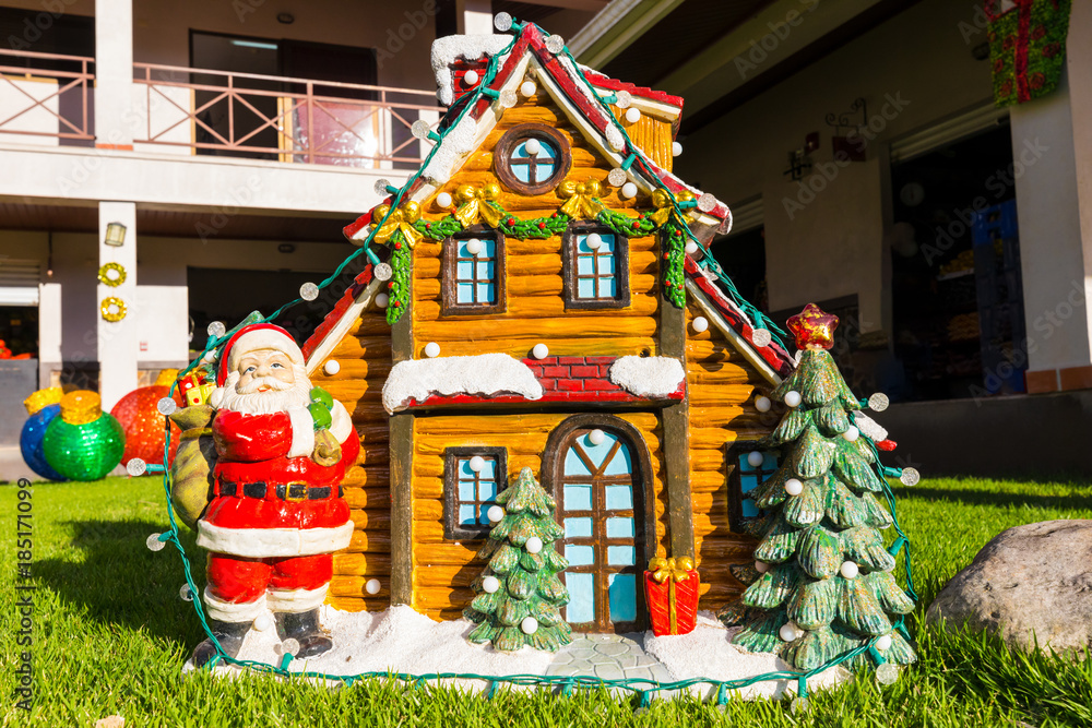 Santa Claus and little house with snow of ceramic Stock Photo | Adobe Stock