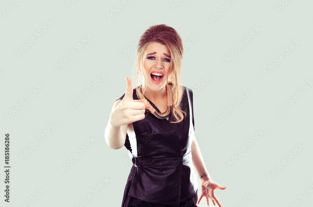 It is you, get out. Angry woman accusing someone screaming pointing ...